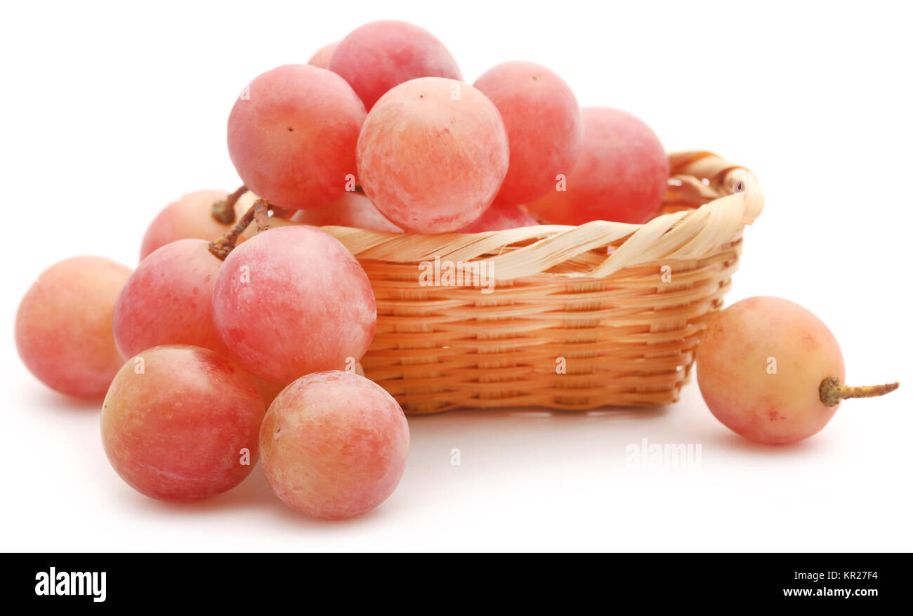 Organic red grapes over white background Stock Photo - Alamy