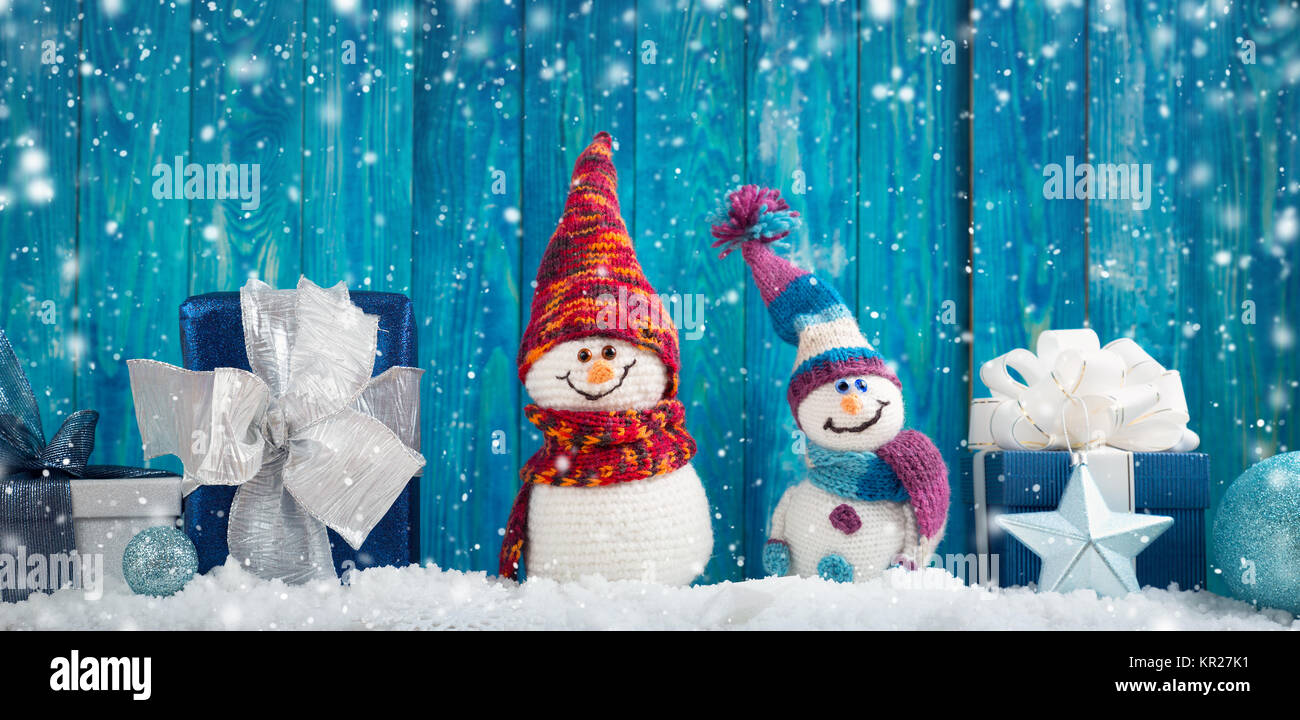 little snowmans on soft snow Stock Photo - Alamy