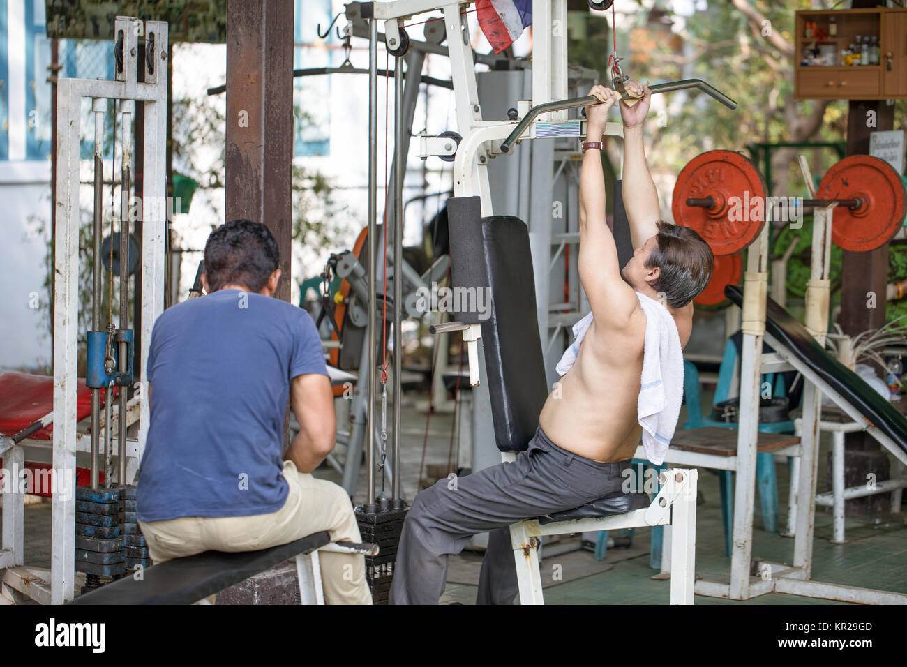 Men doing exercise at public gym in the Saranrom Park, close to royal ...