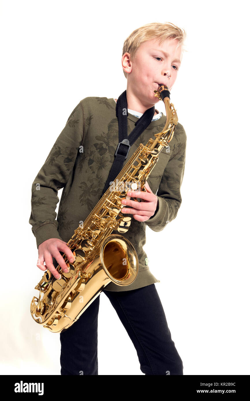 young blond boy and saxophone in studio against white background Stock ...