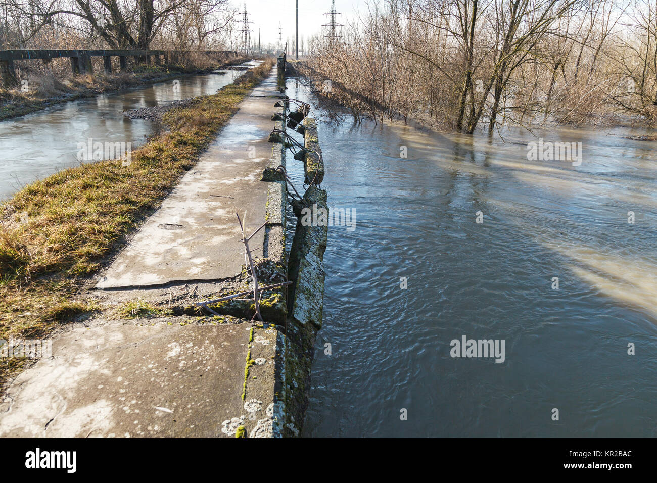 Damaged railings of the bridge across the river. Flooding on the river ...