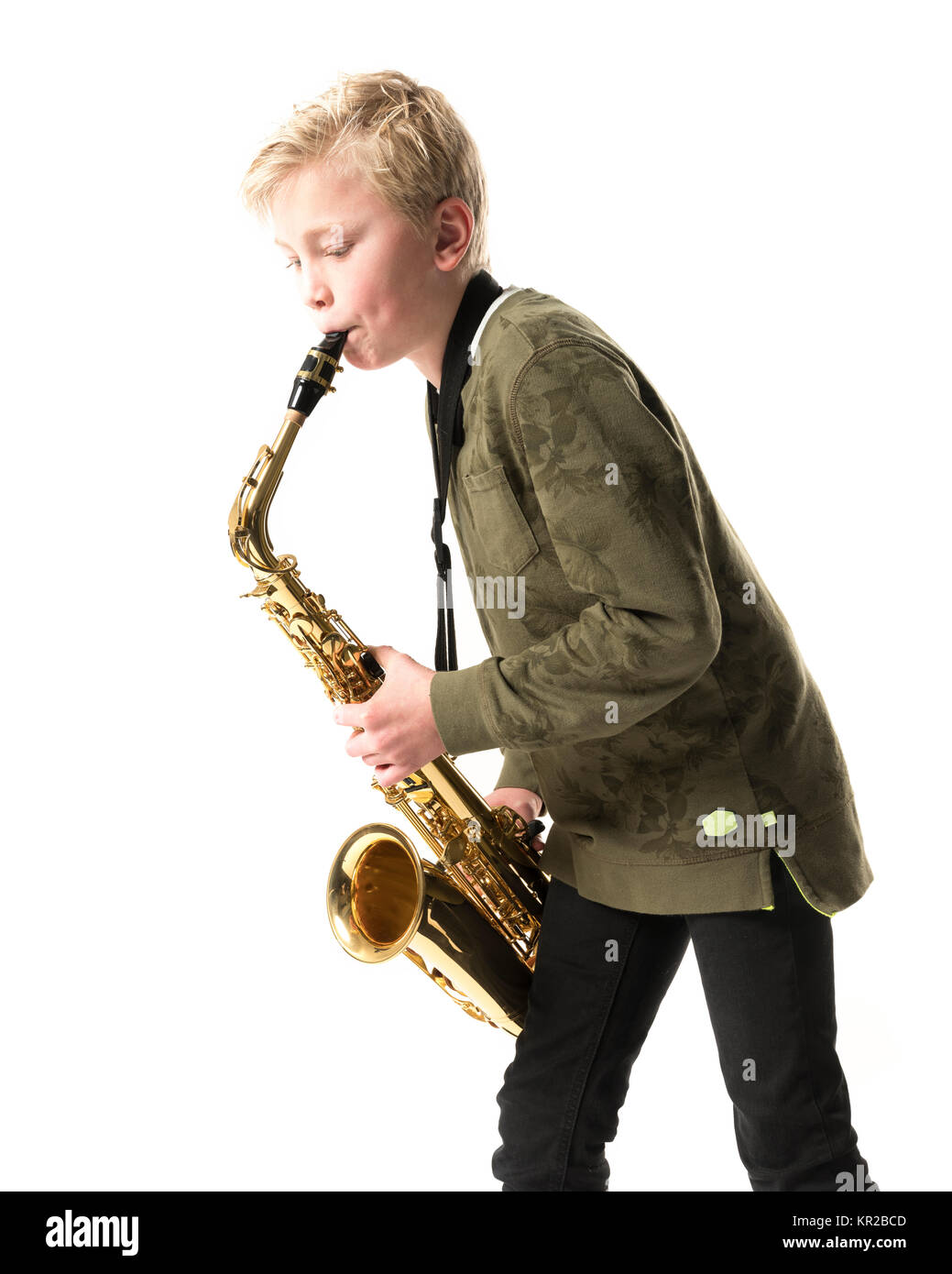young blond boy and saxophone in studio against white background Stock ...