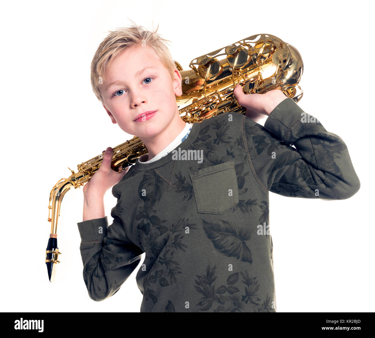 young blond boy and saxophone in studio against white background Stock ...