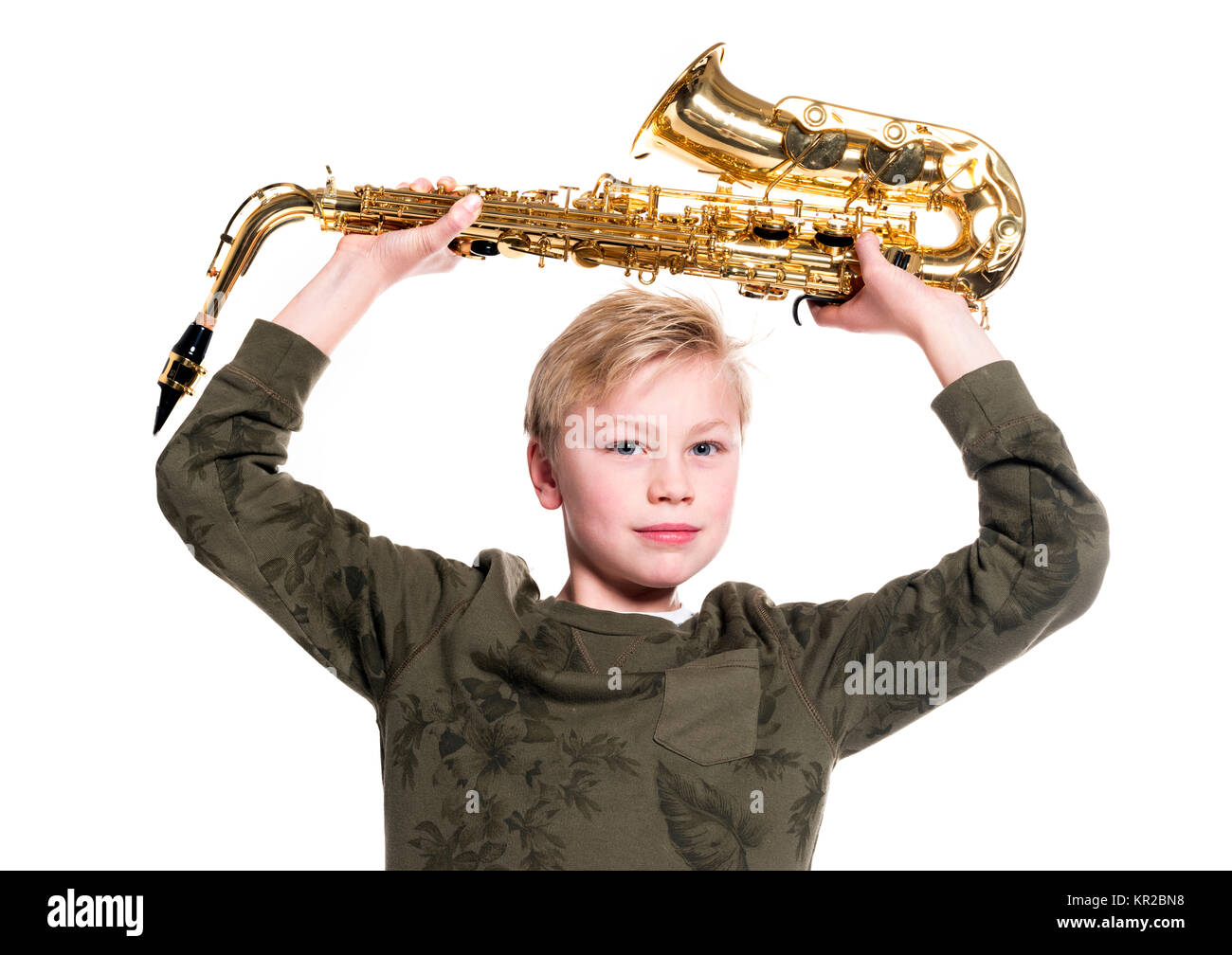 young blond boy and saxophone in studio against white background Stock ...