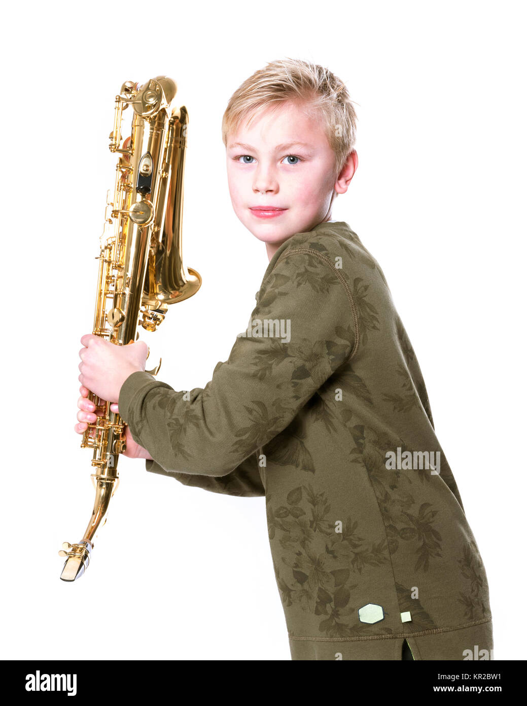 young blond boy and saxophone in studio against white background Stock ...