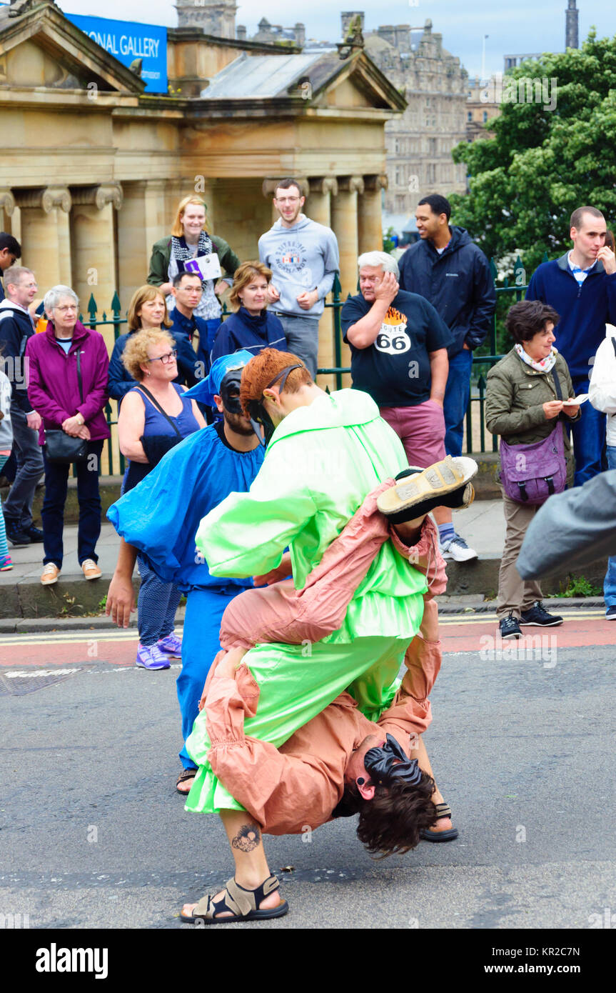 Acrobatics by performers wearing masks and costumes in the Carnival of ...