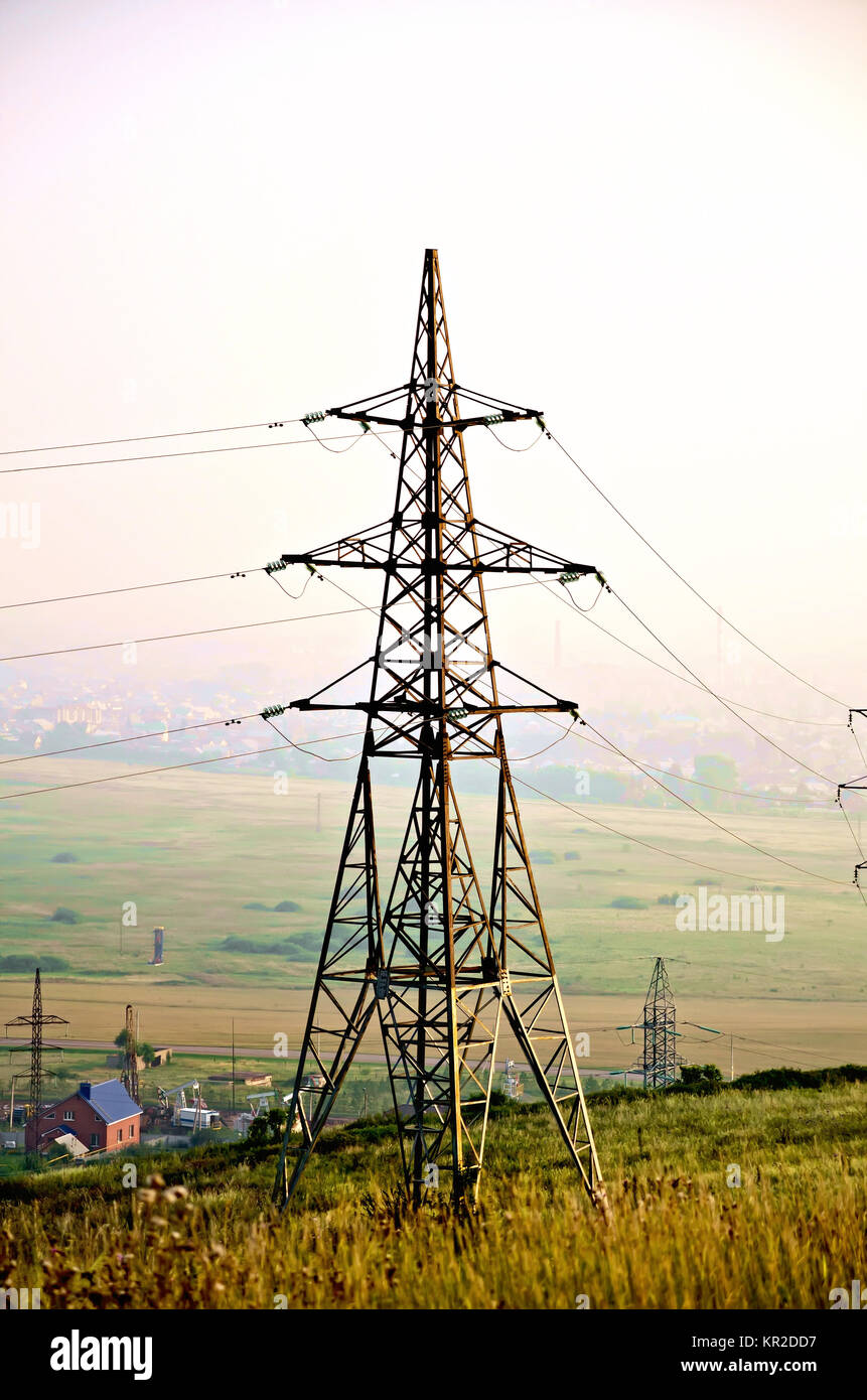 Power line at sunset Stock Photo - Alamy