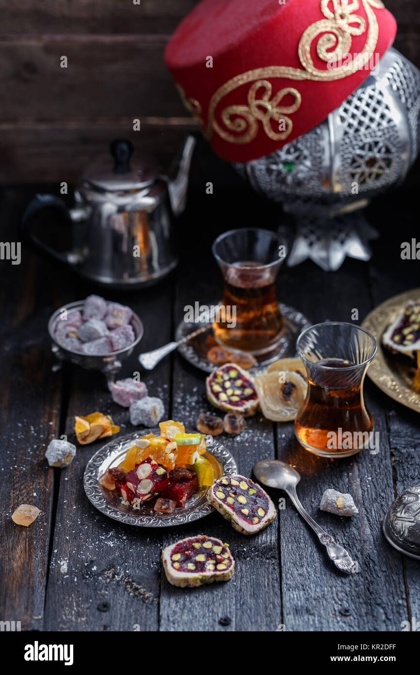 Traditional Turkish tea with traditional oriental sweets, dark ...
