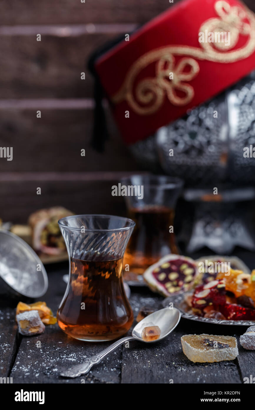 Traditional Turkish tea with traditional oriental sweets, dark ...