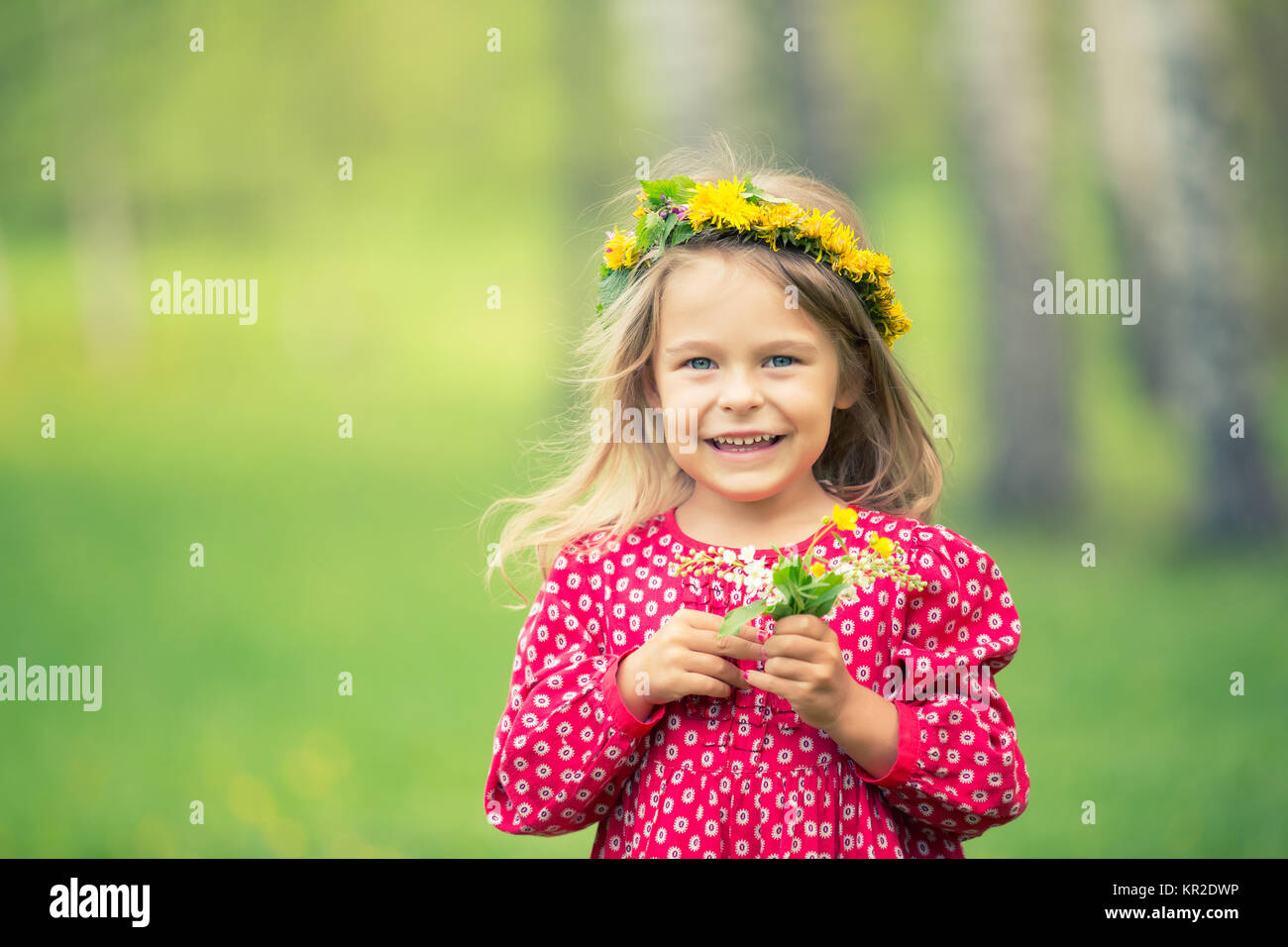 Little girl in spring park Stock Photo - Alamy