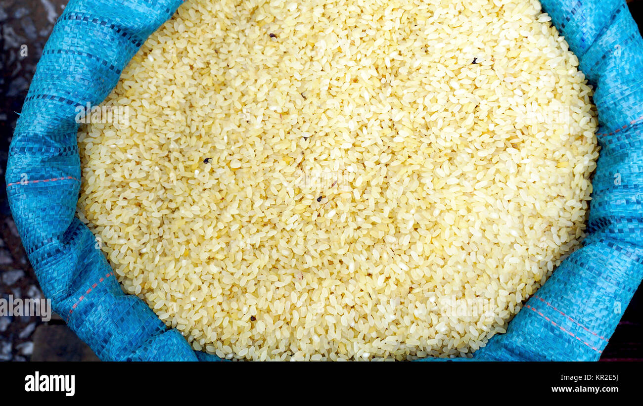 Close up Rice in blue sack Stock Photo - Alamy