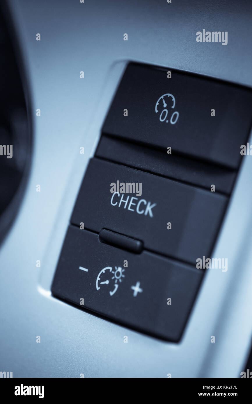 Car check button Stock Photo - Alamy