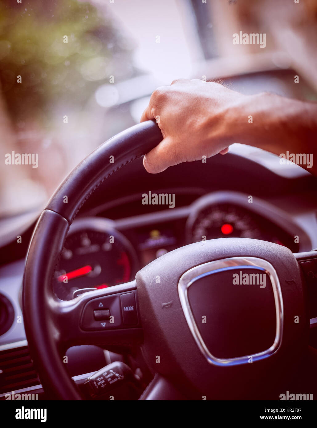 Hands on steering wheel Stock Photo - Alamy