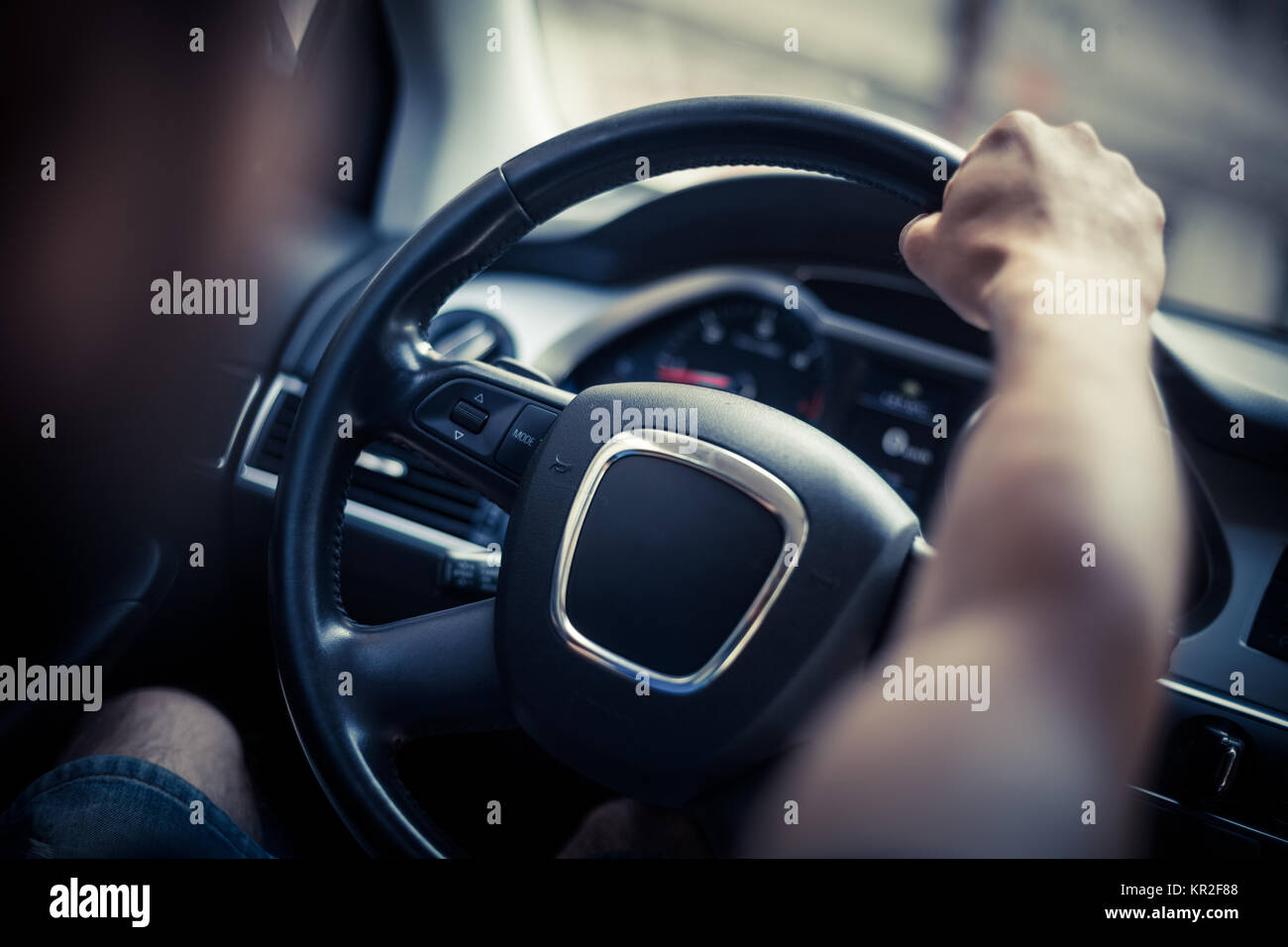 Hands on steering wheel Stock Photo - Alamy
