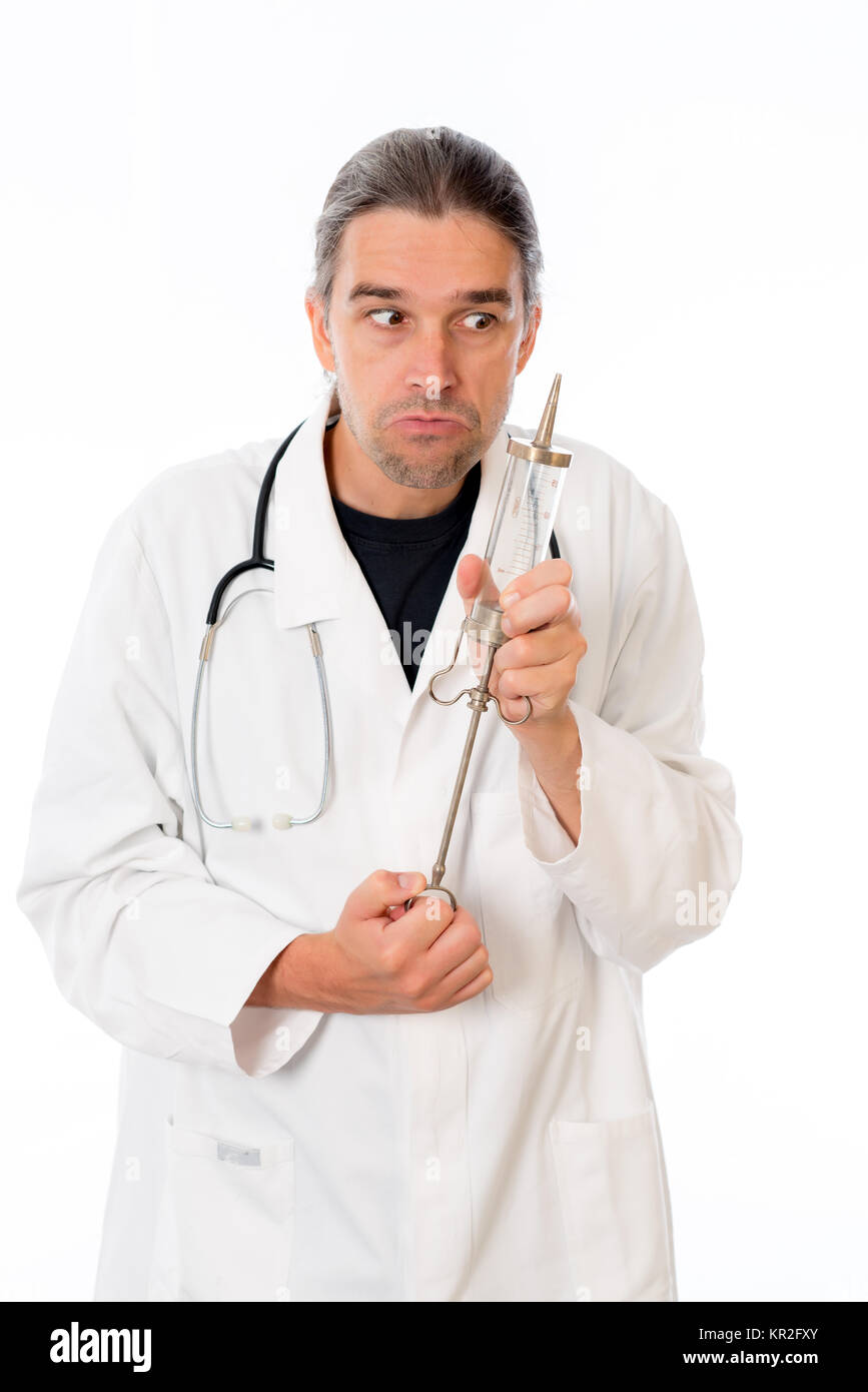 funny doctor with a big injection in white lab coat Stock Photo - Alamy