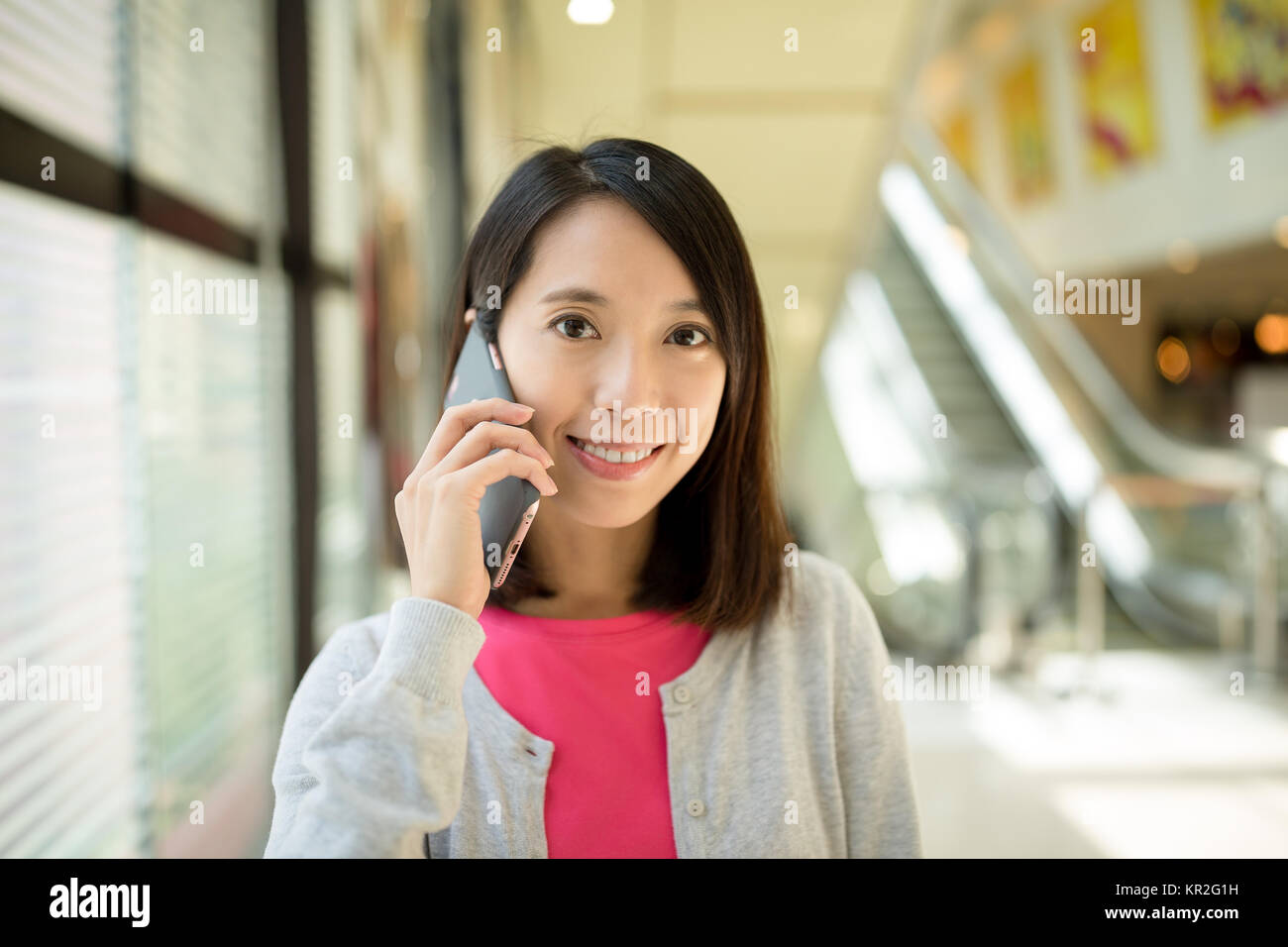 Woman talk to mobile phone Stock Photo - Alamy