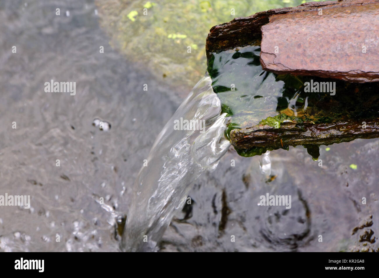 clear water trickles from a rusty pipe Stock Photo - Alamy