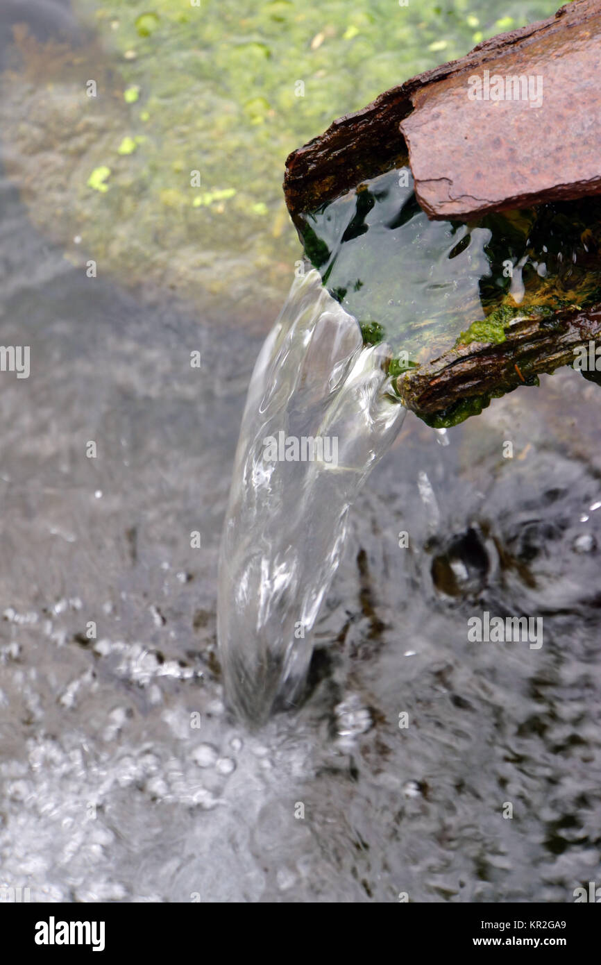 clear water trickles from a rusty pipe Stock Photo - Alamy