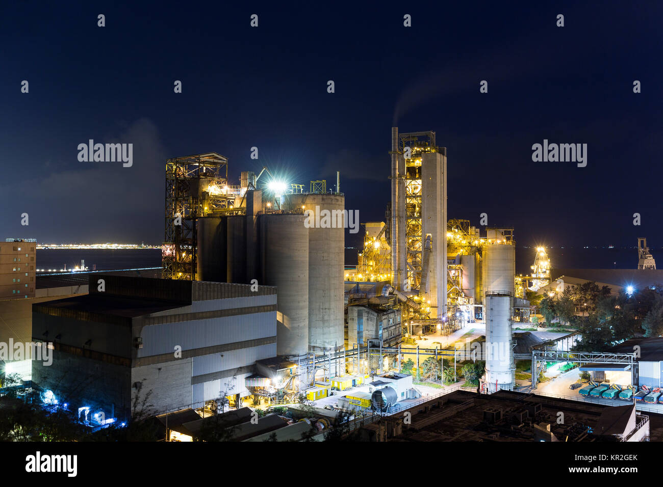 Concrete cement factory at night Stock Photo - Alamy