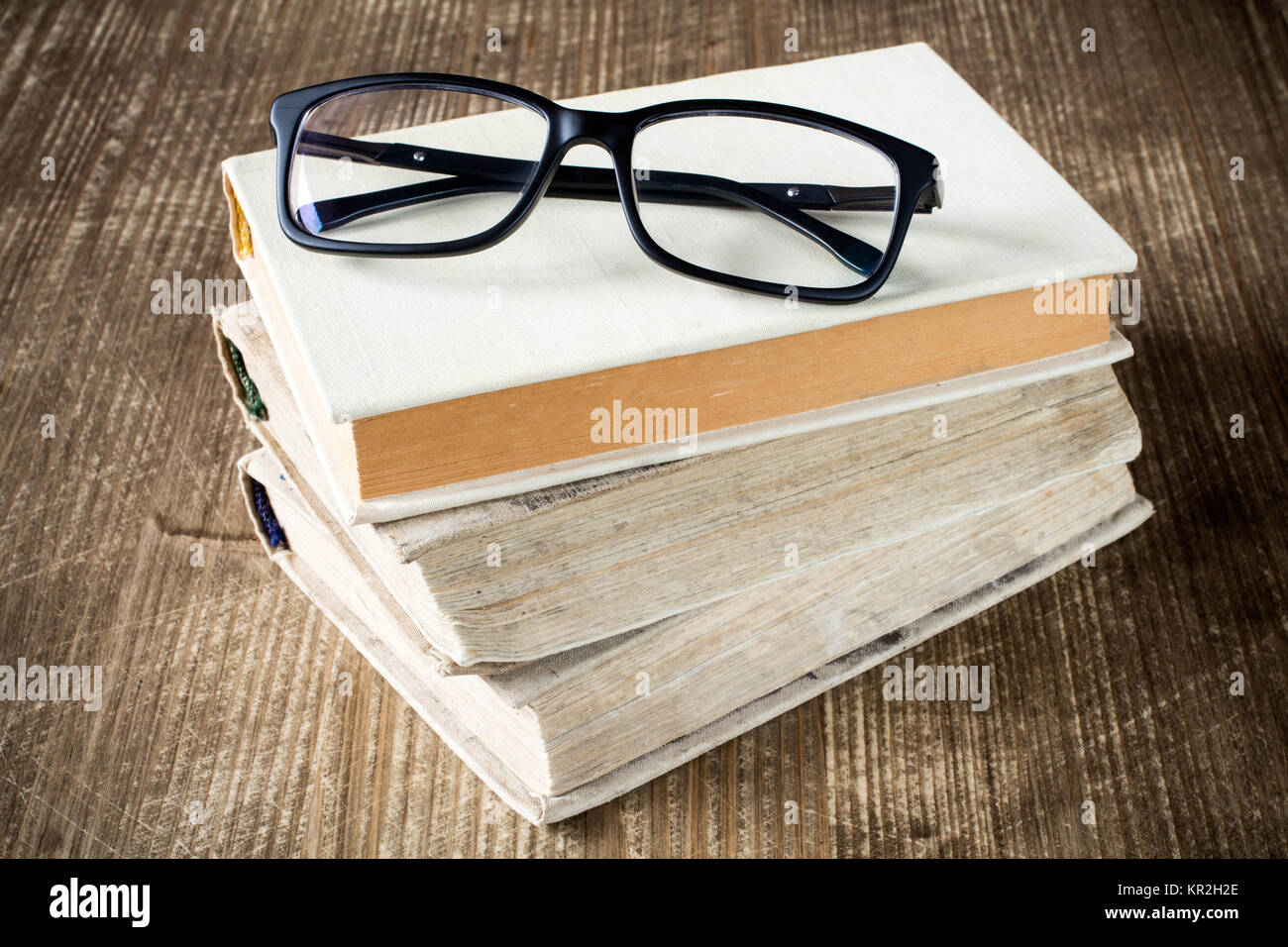 Books and reading glasses Stock Photo - Alamy