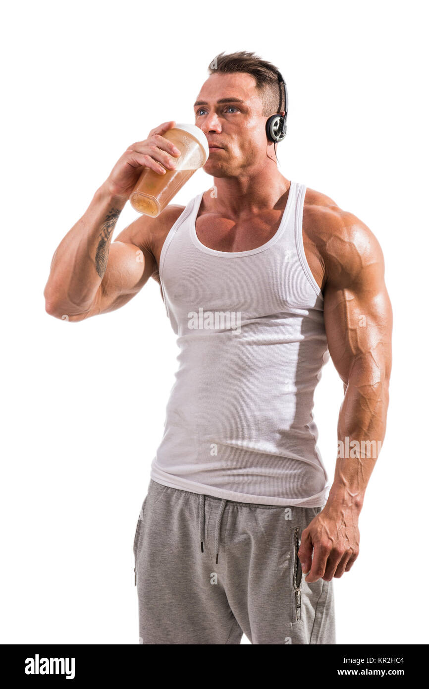 Muscular male bodybuilder holding shaker Stock Photo - Alamy