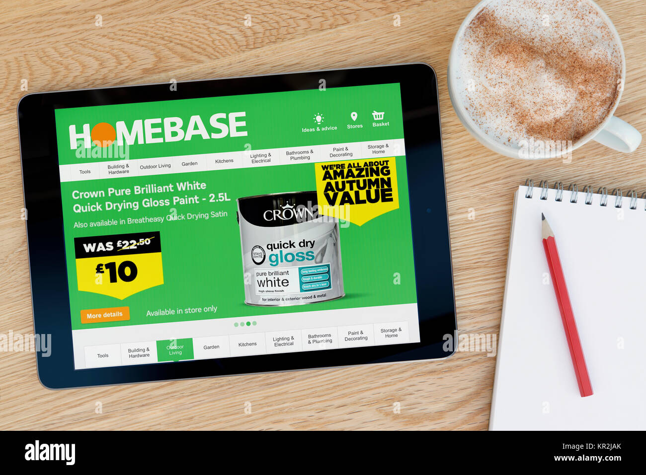 The Homebase website on an iPad tablet device which rests on a wooden ...