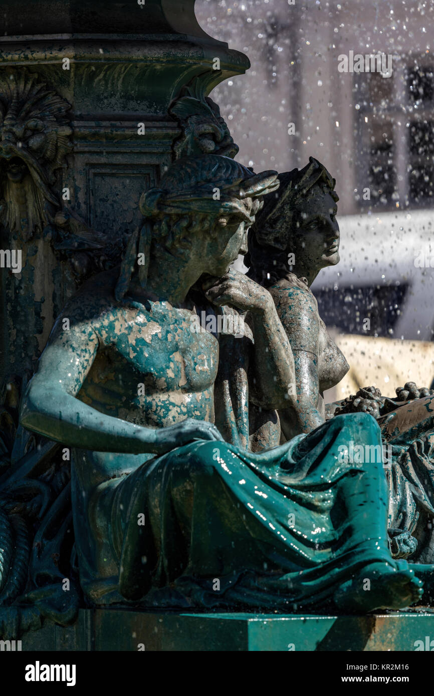Bronze divinity statues in the Rossio Square's fountain, built in 1889 ...
