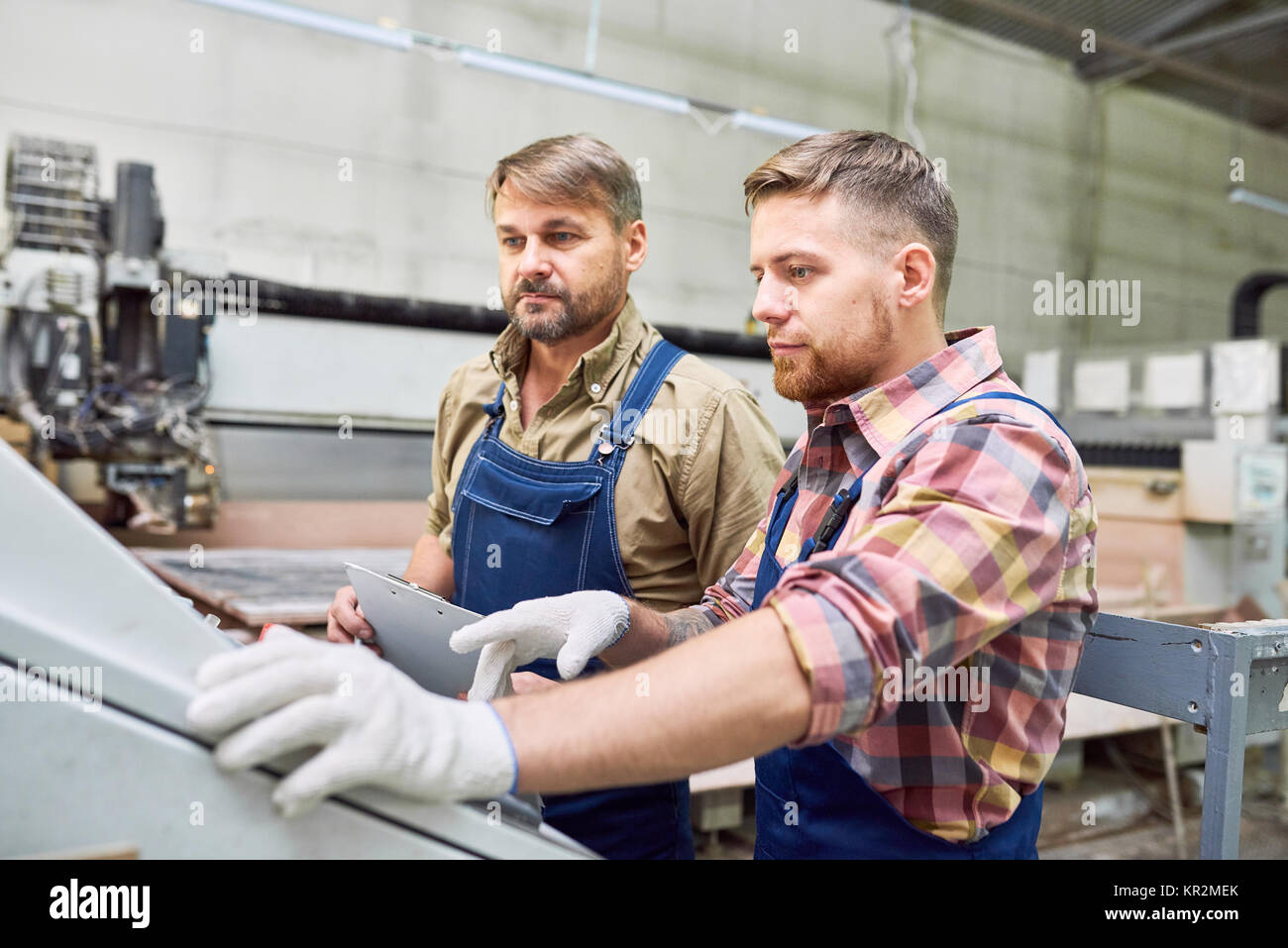 Man operating machines hi-res stock photography and images - Alamy