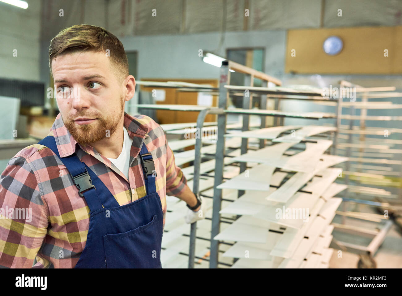 Young Factory Worker in Workshop Stock Photo - Alamy