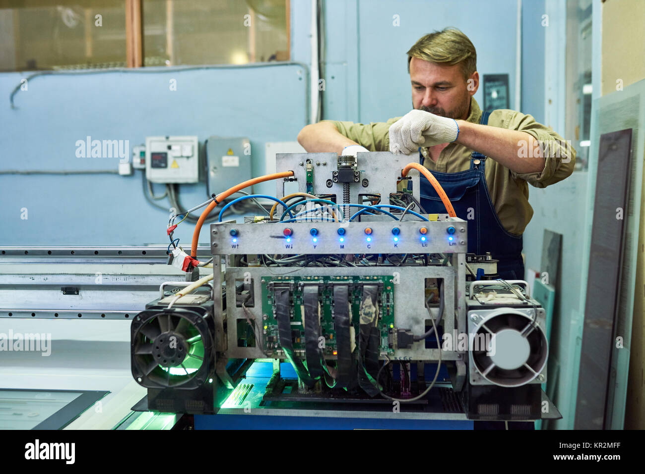 Mechanic Fixing Machine at Factory Stock Photo - Alamy