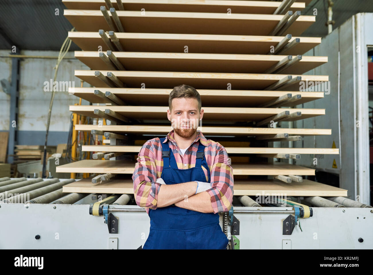Smiling worker in manufacturing plant hi-res stock photography and ...