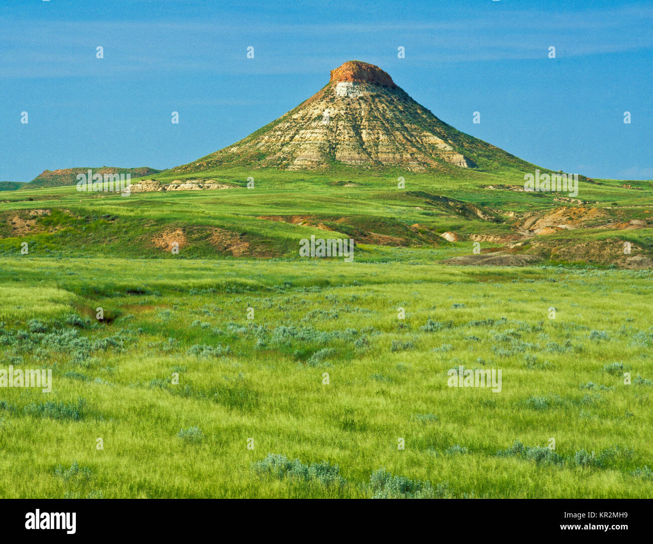 butte rising above the prairie at terry badlands near terry, montana ...