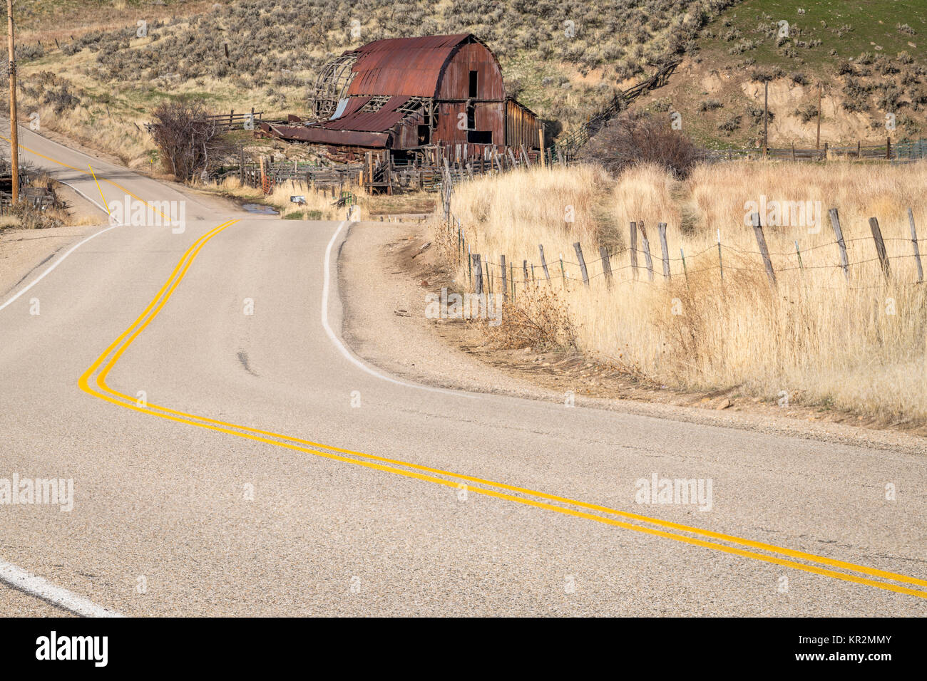 Country farm barn on the side of a winding road Stock Photo - Alamy