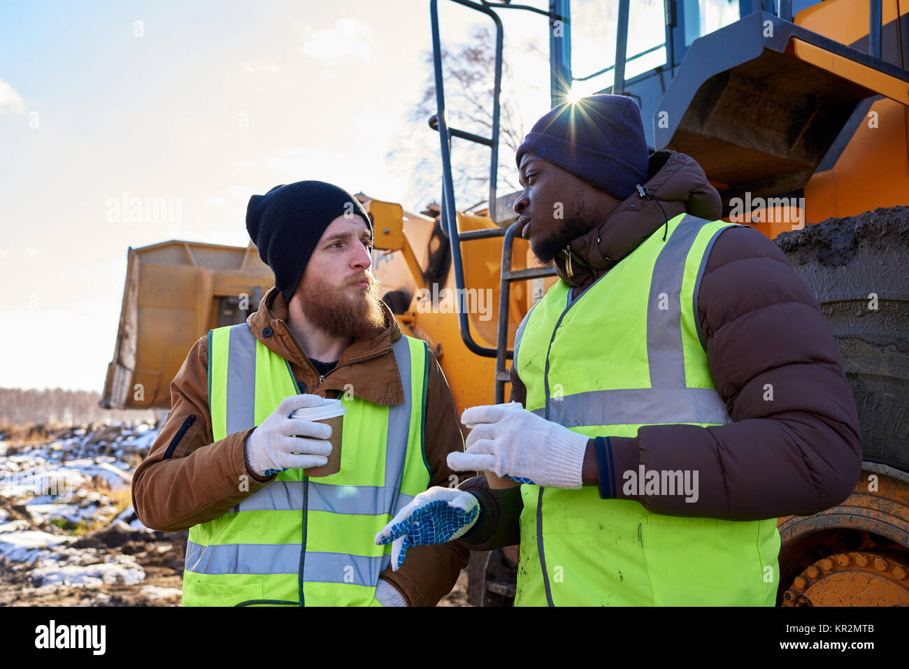 Workers Taking Break in Cold Stock Photo - Alamy