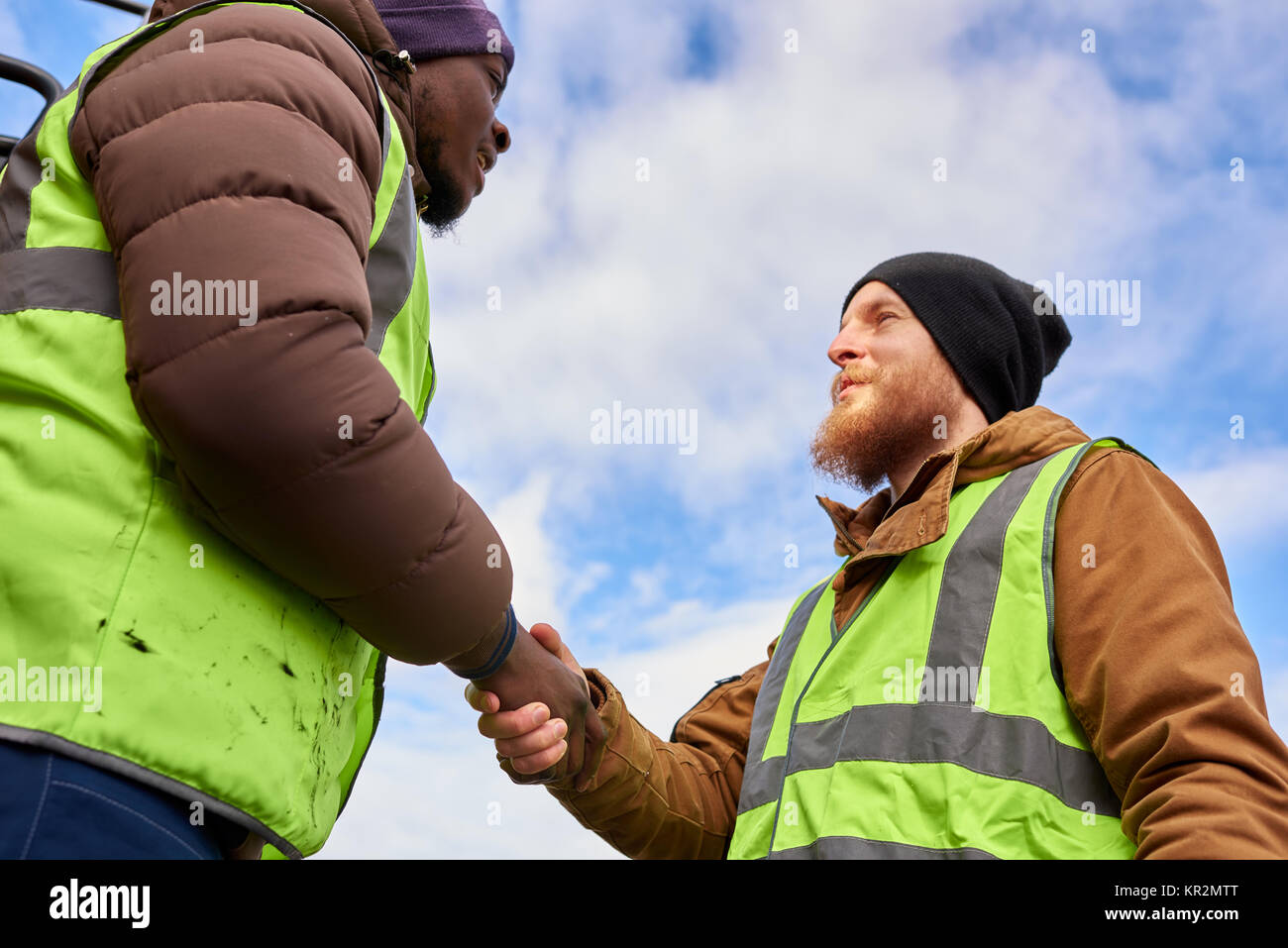 Workers Shaking Hands Outdoors Stock Photo - Alamy