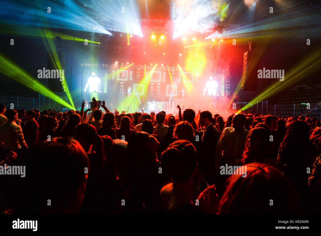 The audience watching the concert on stage in big concert club Stock ...