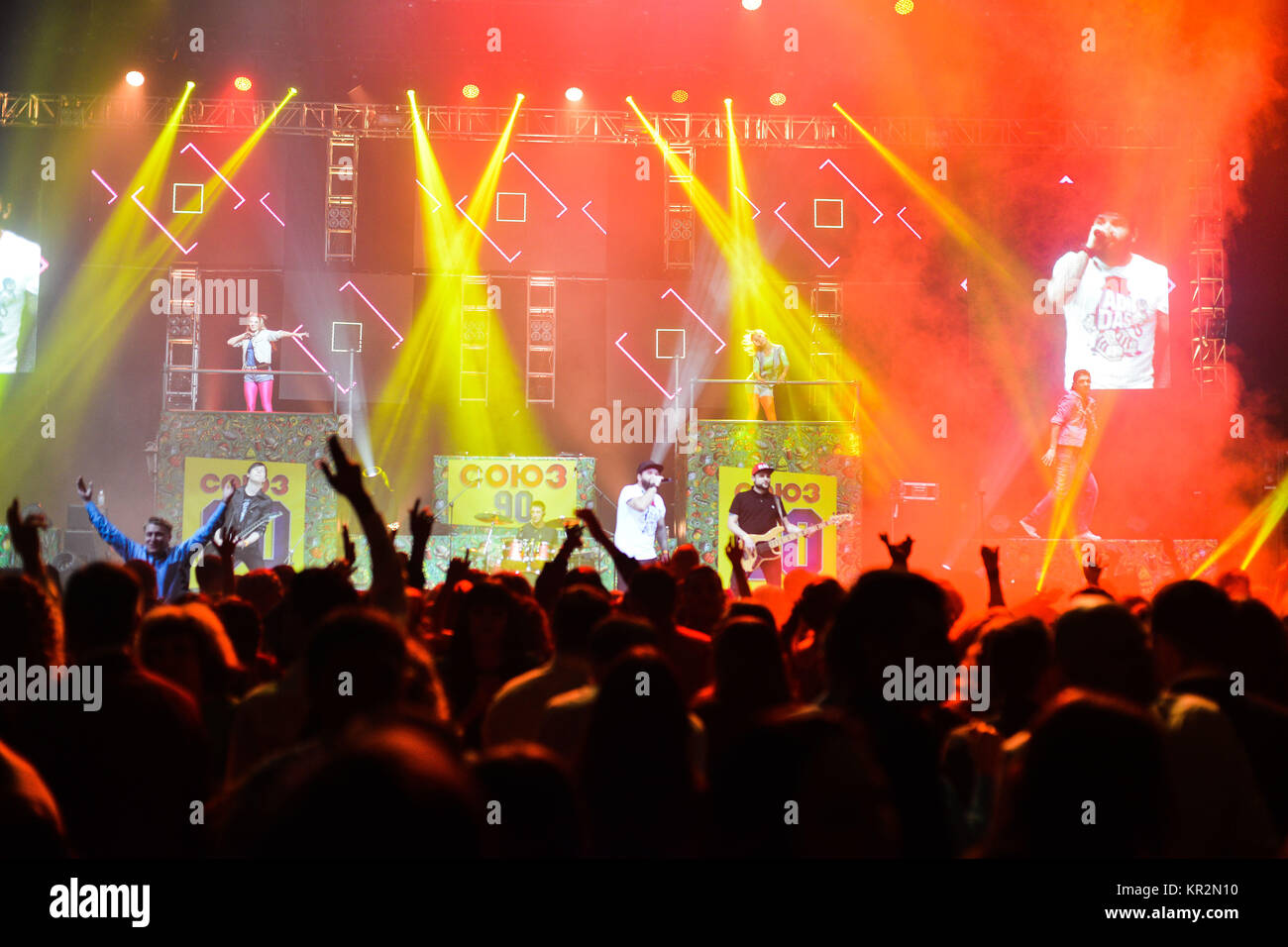 The audience watching the concert on stage in big concert club Stock ...
