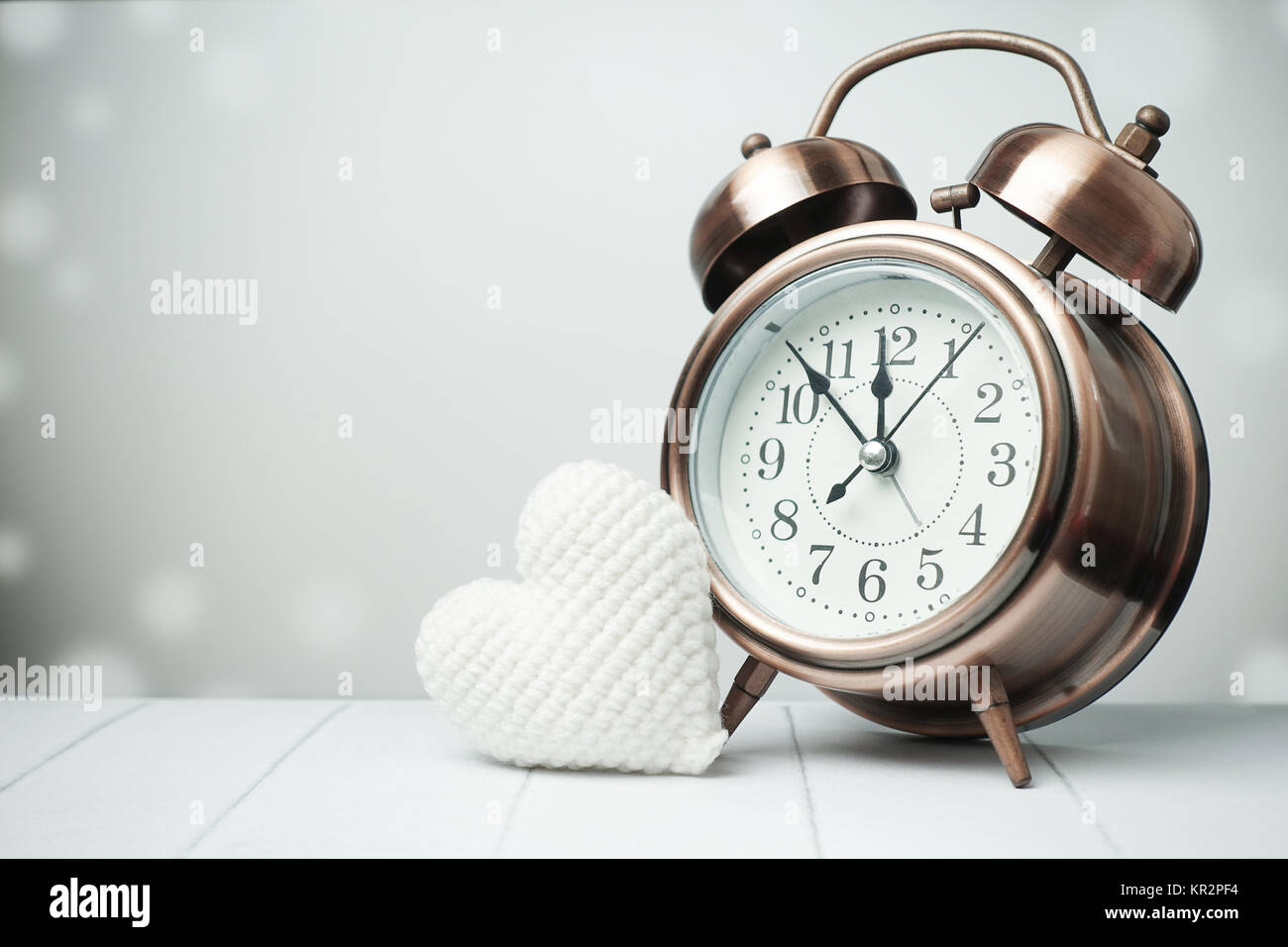 retro clock with love white heart yarn on gray background - love with ...