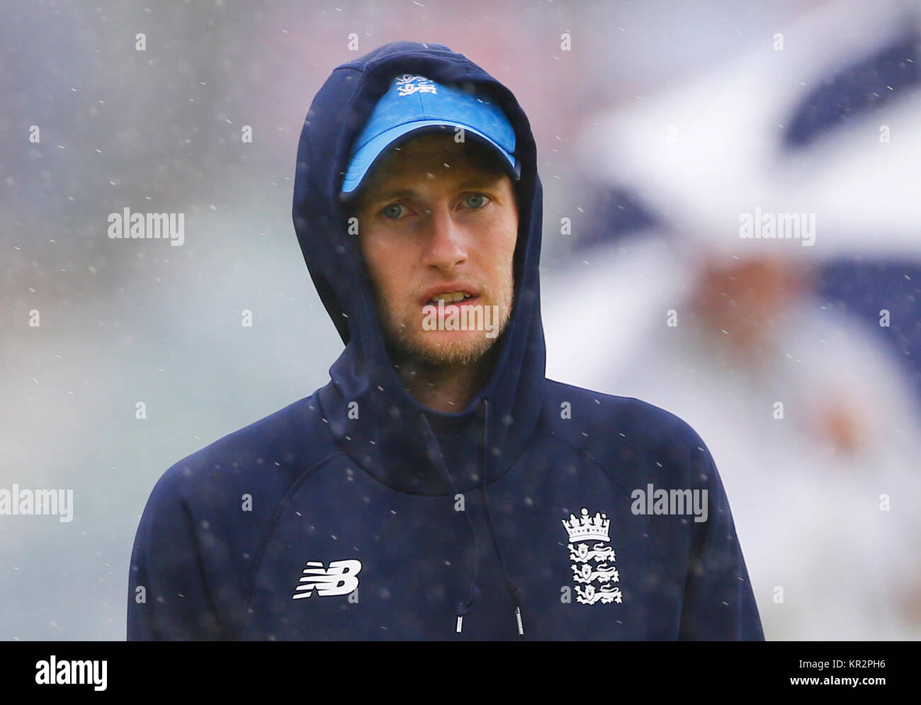 England captain Joe Root looks on as rain halts the start of play ...