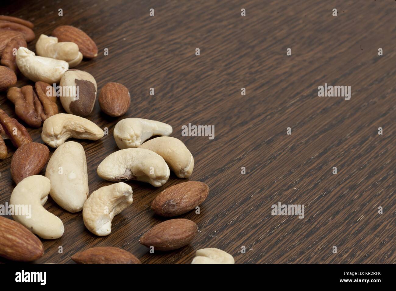 scattered assorted kinds of nuts Stock Photo - Alamy