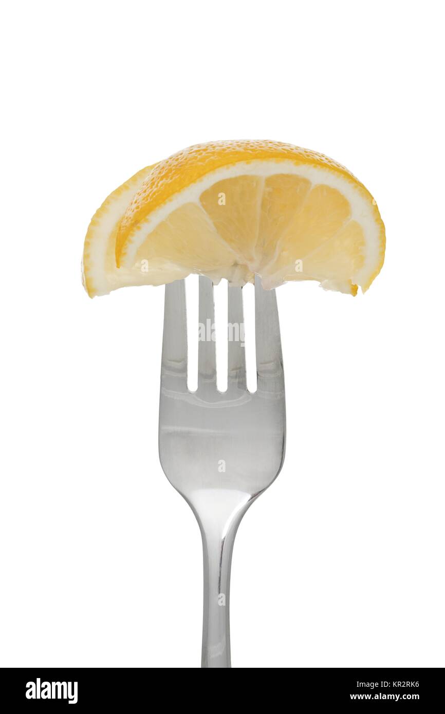 sliced lemon on fork Stock Photo - Alamy