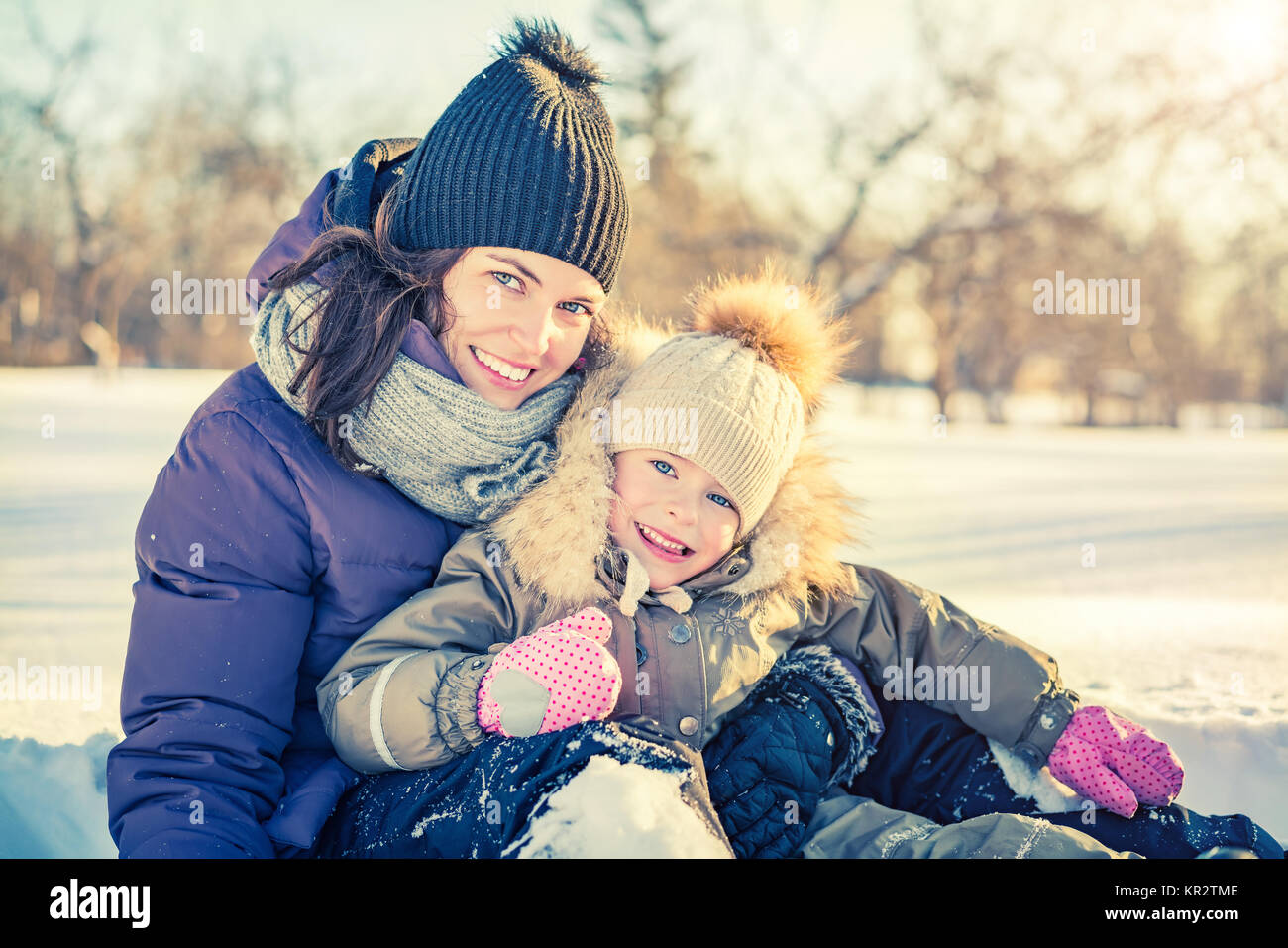 Mother and daughter playing at winter day Stock Photo - Alamy