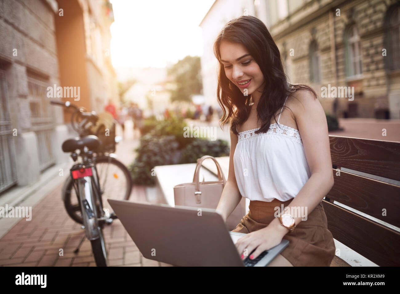 Portrait of attractive young girl using laptop Stock Photo - Alamy