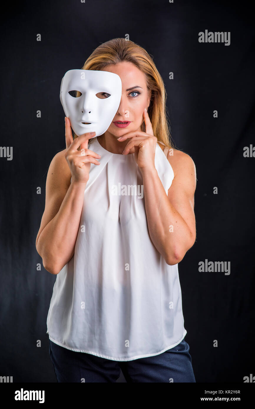 Woman holding theatre mask Stock Photo - Alamy