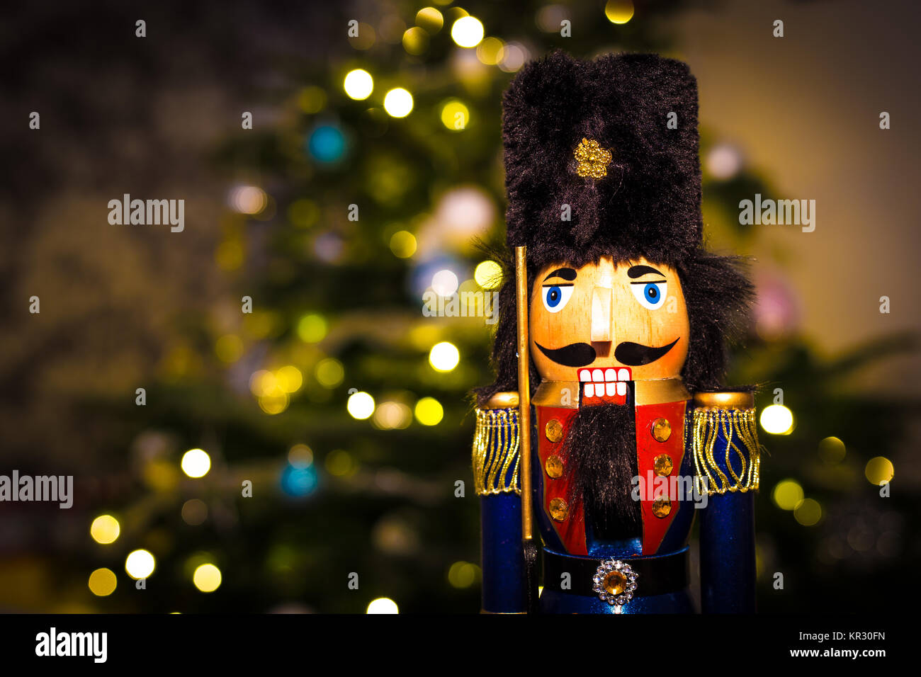 Christmas nutcracker with Christmas tree in background Stock Photo - Alamy