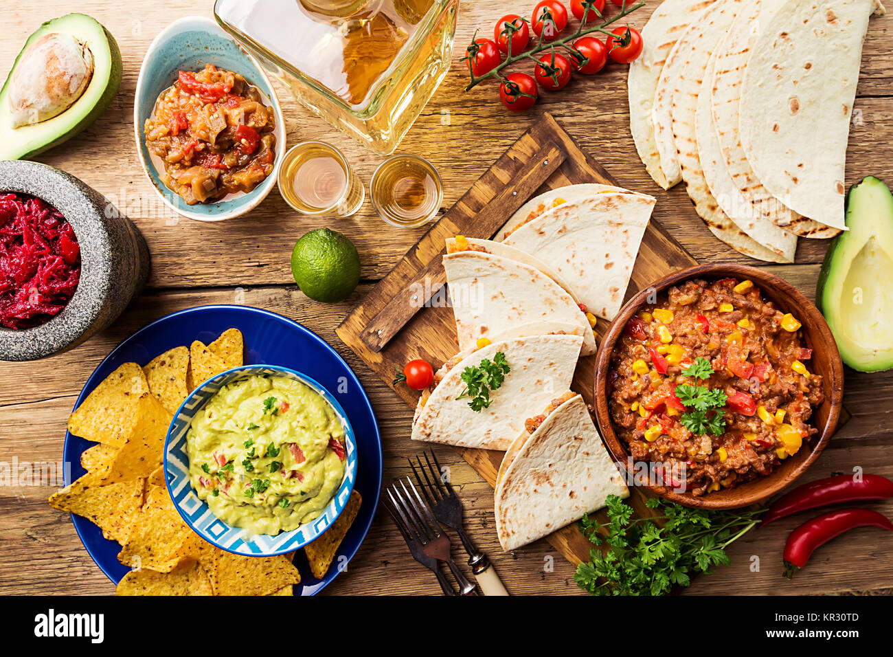 Mexican food mix: nachos, fajitas, tortilla, guacamole and salsa sauces ...