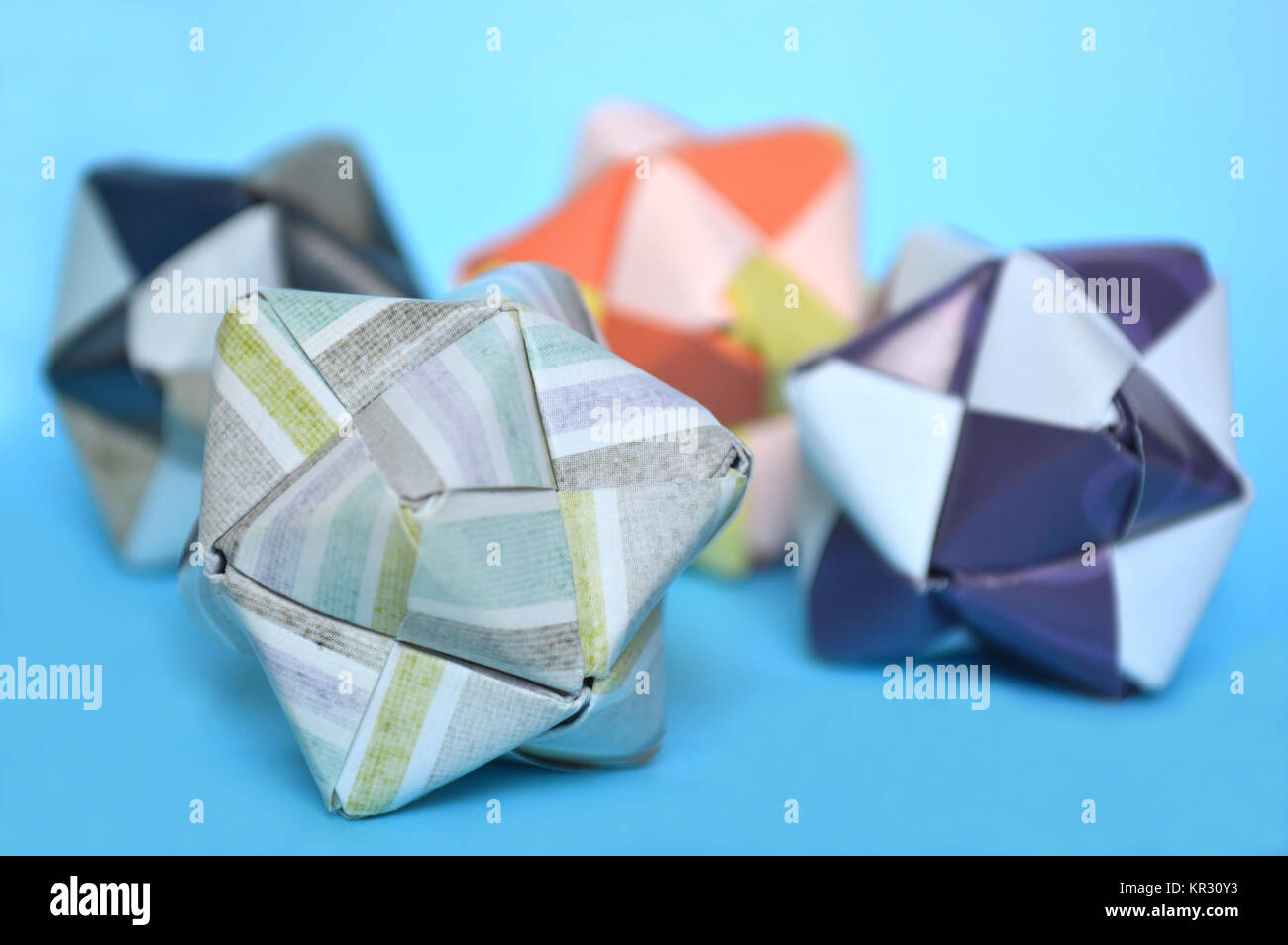 Modular origami, sonobe ball, on blue background Stock Photo - Alamy