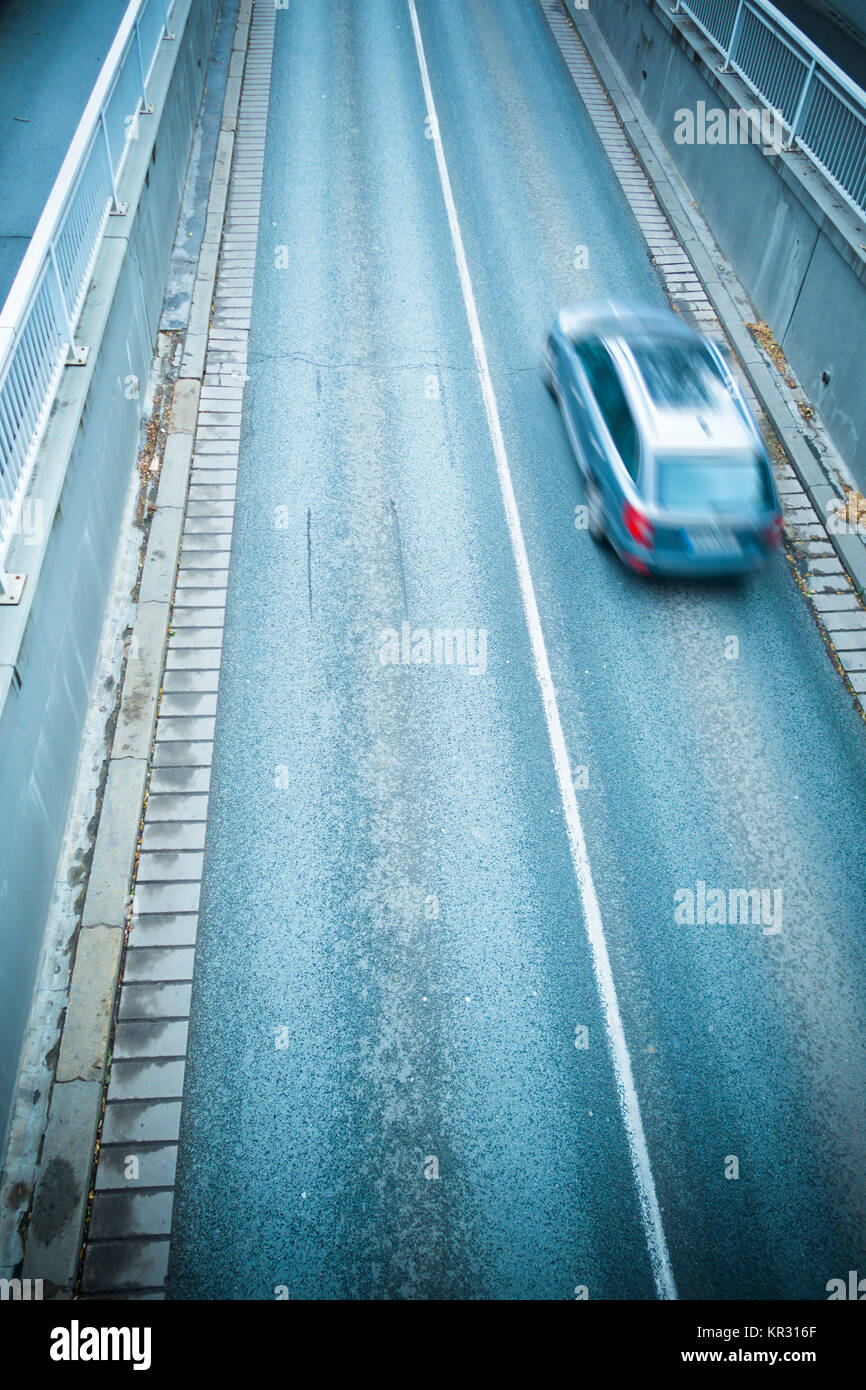 car running fast on the road, motion and speed concept Stock Photo - Alamy