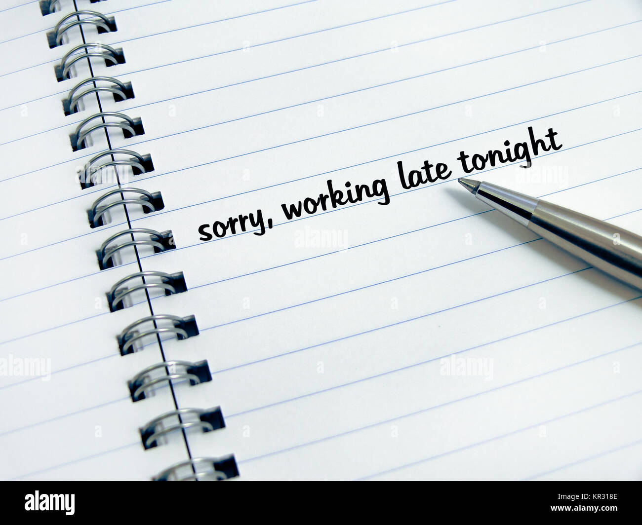 pen and phrase "sorry, working late tonight" on a notebook Stock Photo ...
