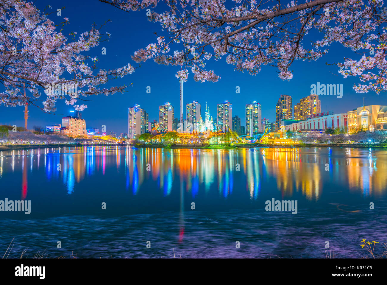SEOUL, KOREA - APRIL 7, 2016: Lotte World Seokchon Lake park at night ...